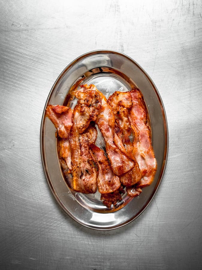 Fried bacon on a plate. stock photo. Image of fried, homemade - 76585184