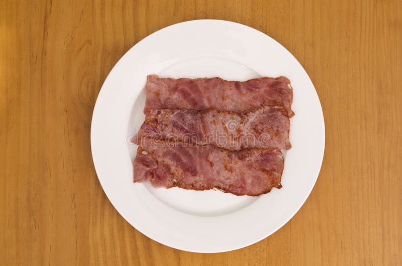 Fried Bacon Strips on Plate Stock Image - Image of unhealthy, gourmet ...