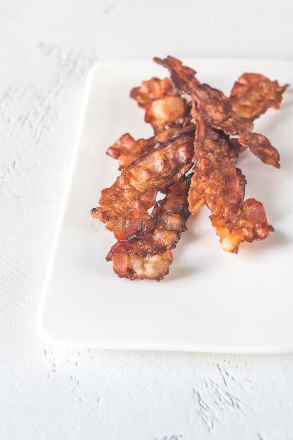 Fried Bacon Strips on the White Plate Stock Image - Image of bacon ...