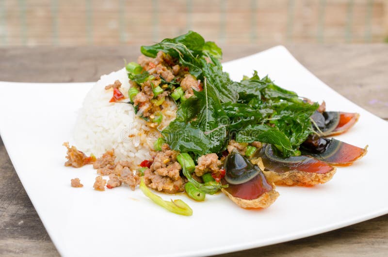 Fried Basil with Pork and Preserved Egg Stock Photo - Image of chili ...
