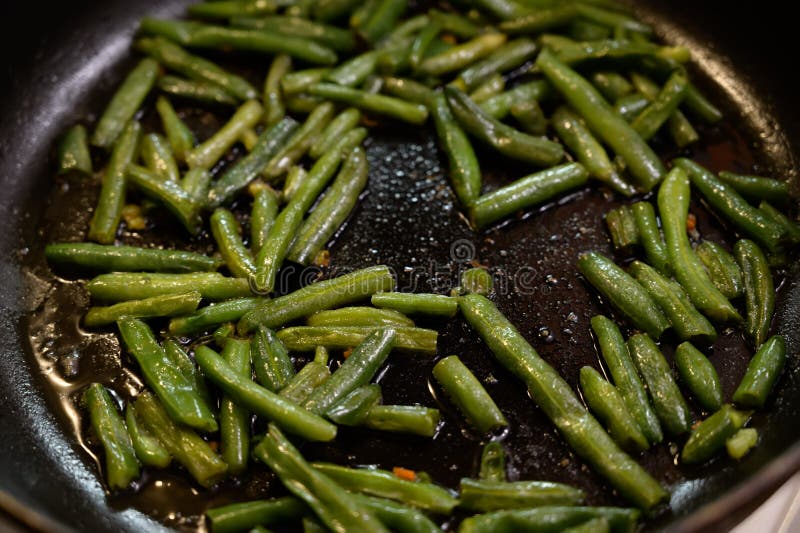 Fried beans in pods a pan. stock image. Image of grilled - 195167723