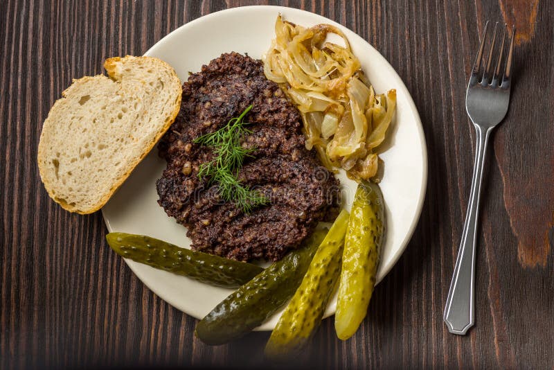 Fried Black Pudding with Additions and Bread Stock Photo - Image of ...