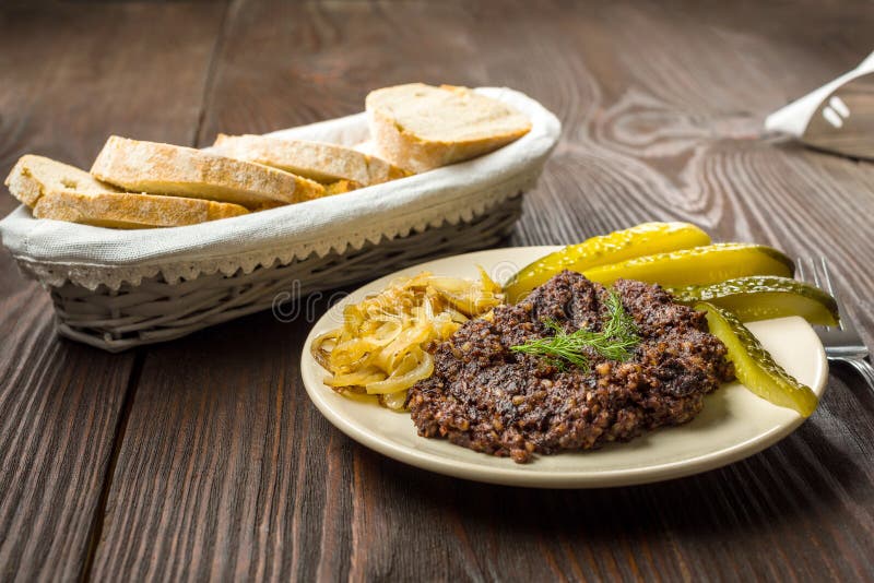 Fried Black Pudding with Additions and Bread Stock Photo - Image of ...