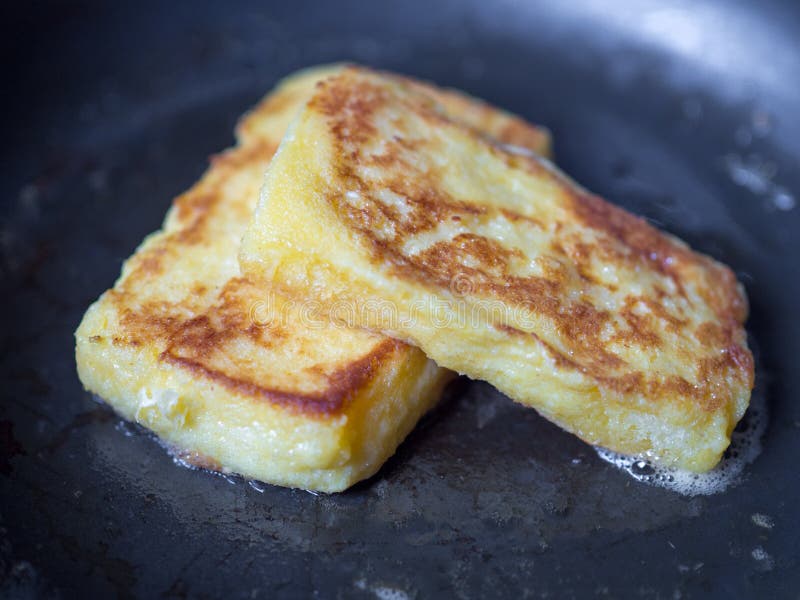 Fried bread on pan stock photo. Image of fried, iron - 116773002