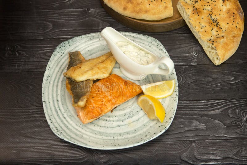 Fried Breaded Fish with White Sauce and Lemon Stock Image - Image of ...