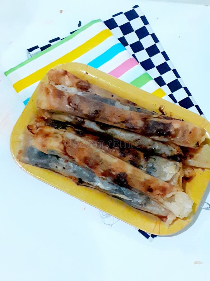 Fried Brown Banana Covered with Spring Rolls Stock Photo - Image of ...