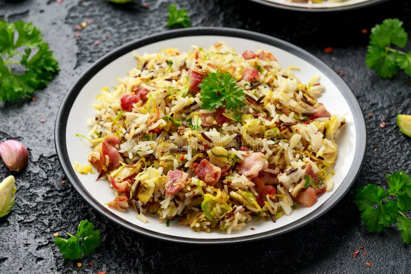 Fried Brussels Sprouts with Rice and Crispy Bacon Stock Photo - Image ...