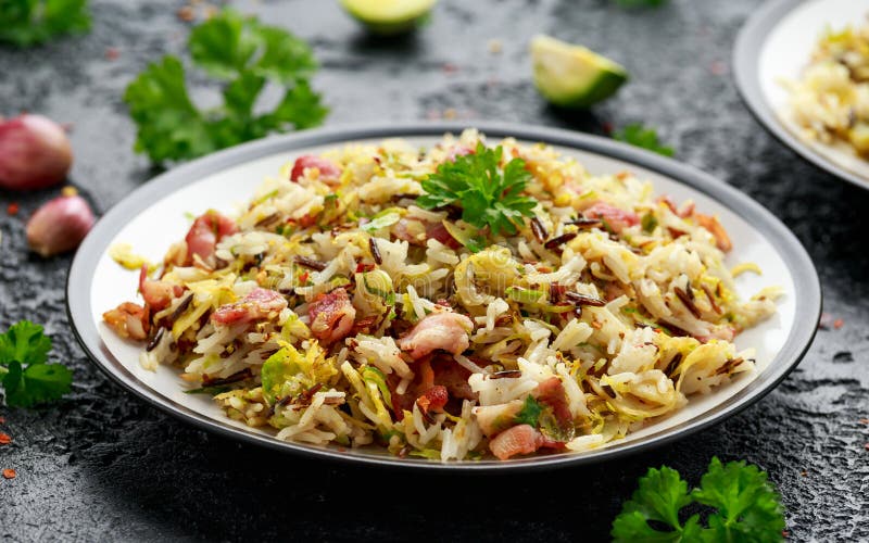 Fried Brussels Sprouts with Rice and Crispy Bacon Stock Image - Image ...
