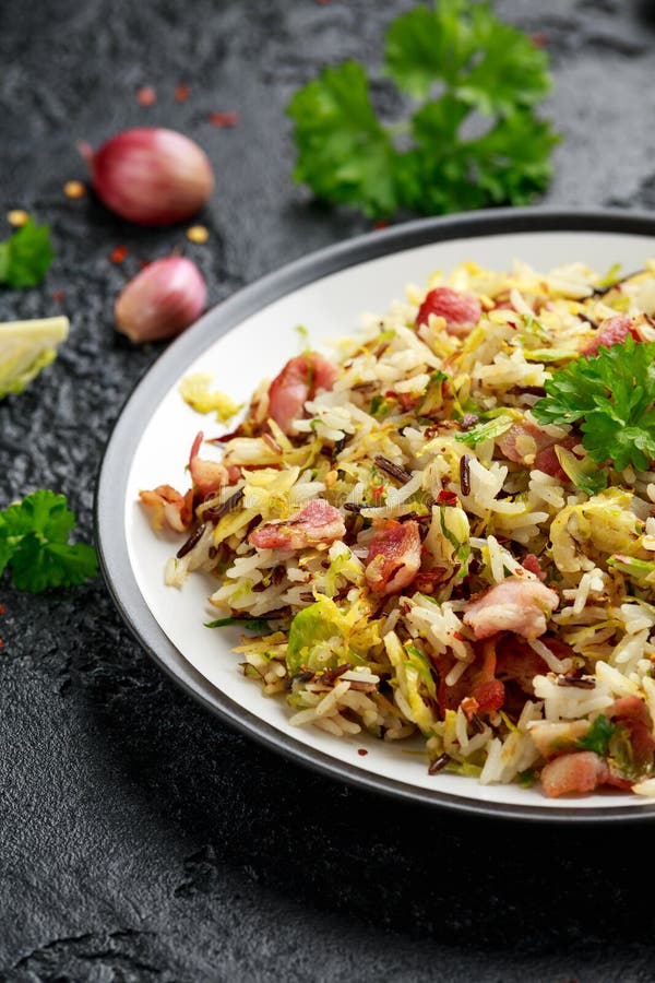 Fried Brussels Sprouts with Rice and Crispy Bacon Stock Image - Image ...