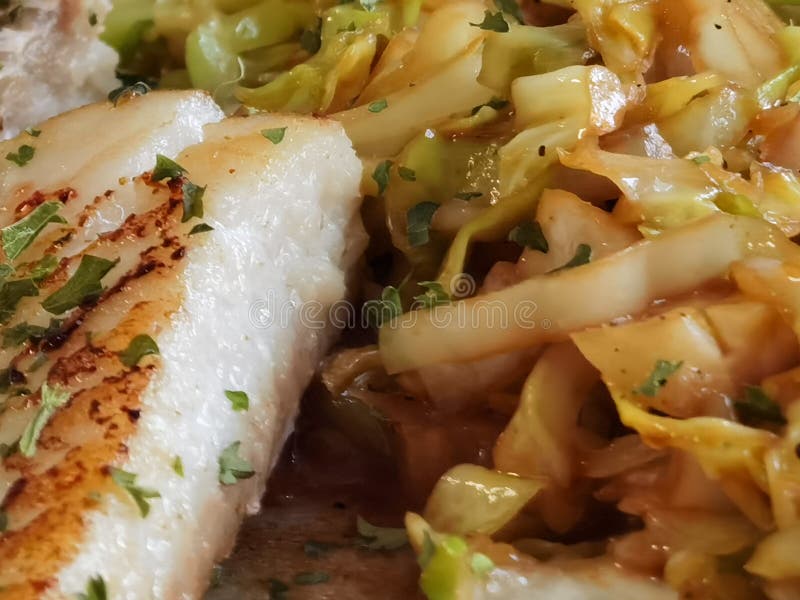 Fried cabbage with fish stock photo. Image of salad - 224381060