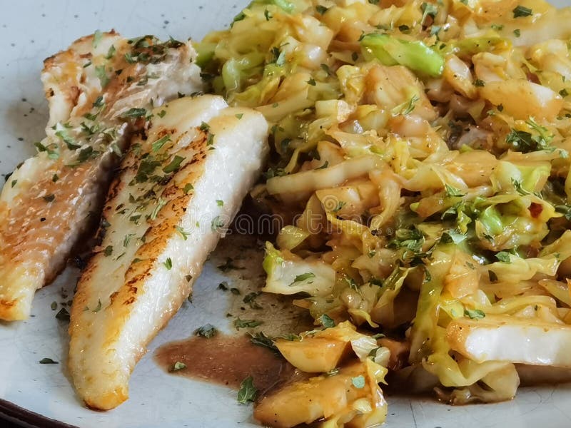 Fried cabbage with fish stock image. Image of produce - 224381063