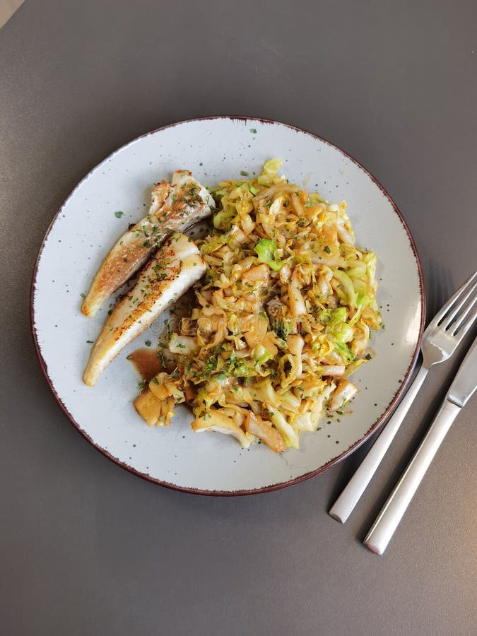 Fried cabbage with fish stock image. Image of dish, vegetable - 224381065