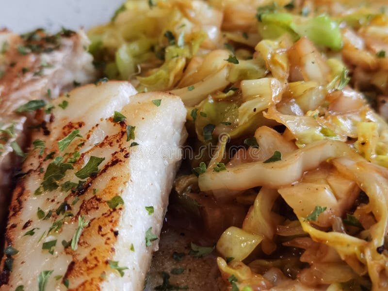 Fried cabbage with fish stock image. Image of produce - 224478463