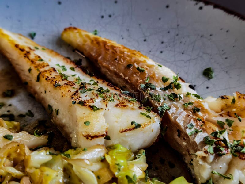 Fried cabbage with fish stock image. Image of dish, produce - 225480461