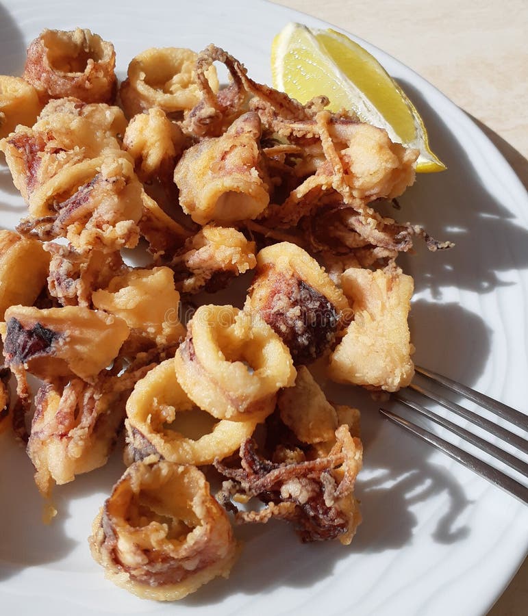 Fried Calamary and Mini Octopus in Dish on Cook Table Stock Image ...