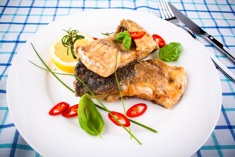 Fried carp fish pieces stock image. Image of eating - 102037893