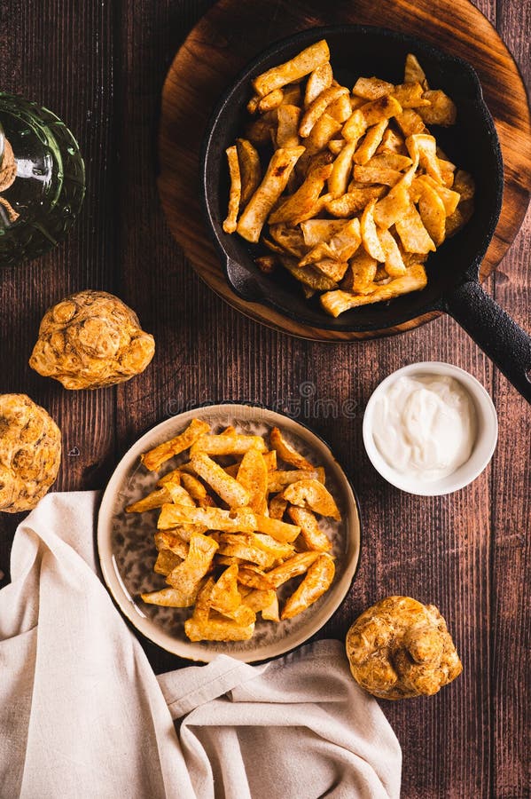 Fried Celery Root on a Plate and Sauce in a Bowl on the Table Top and ...