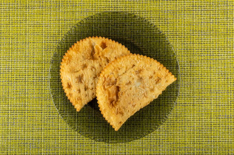Fried Cheburek in Gray Plate on Yellow Mat. Top View Stock Image ...