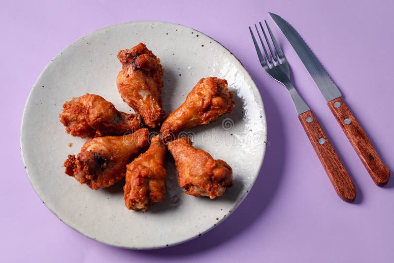 Fried Chicken in Ceramic Plates with Cutlery on the Side Stock Photo ...