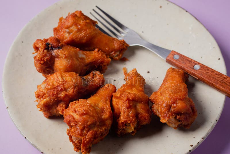 Fried Chicken in Ceramic Plates with Cutlery on the Side Stock Photo ...
