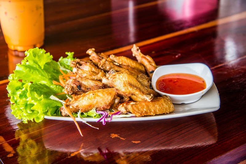 Fried Chicken with Fish Sauce on Modern Plate Stock Photo - Image of ...