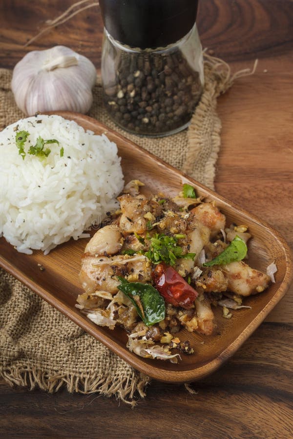 Fried Chicken with Garlic and Pepper with Rice. Thai Dish Stock Photo ...