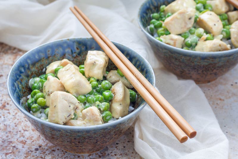 Fried Chicken with Green Peas in Cream Sauce, Served with Rice Stock ...