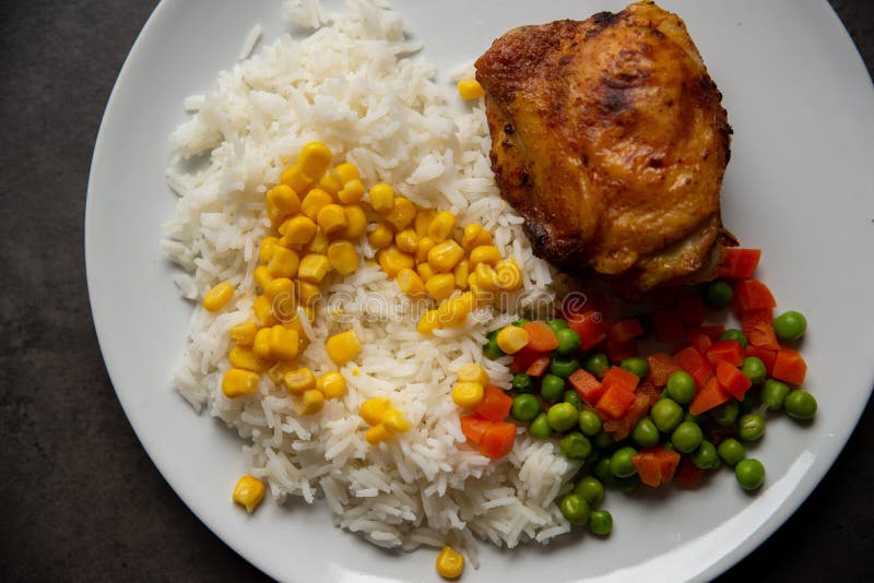 Fried Chicken Leg with Rice, Corn, Carrots and Peas Stock Image - Image ...