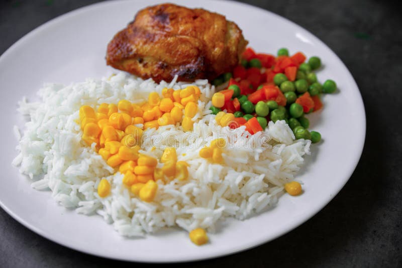 Fried Chicken Leg with Rice, Corn, Carrots and Peas Stock Image - Image ...