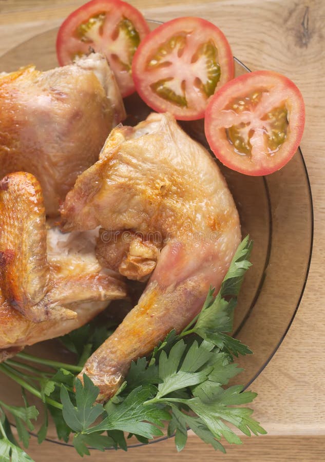 Fried Chicken Leg and Wing with Tomatoes and Herbs Stock Image - Image ...