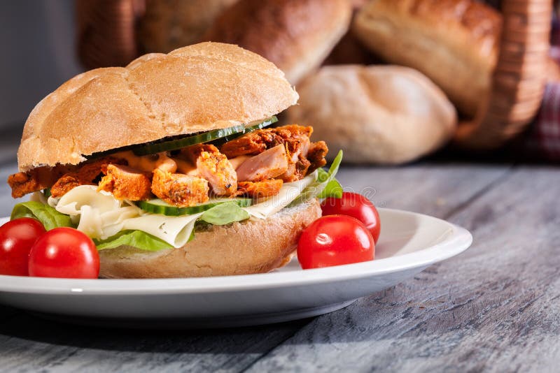 Fried Chicken Meat with Cheese and Vegetables in Bun Stock Photo ...