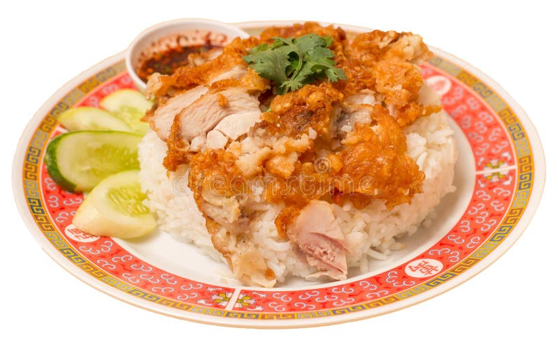 Fried Chicken Place on Top the Rice with Cucumbers and Sauce. Stock ...