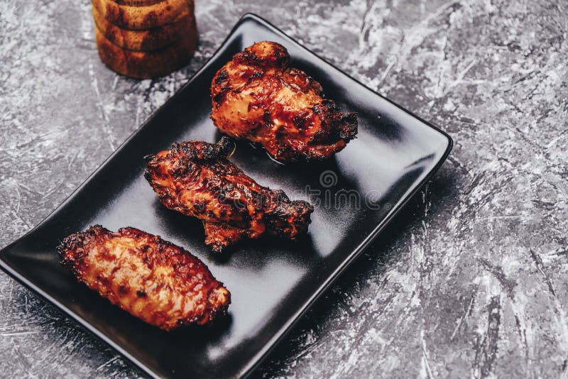 Fried Chicken Portions on a Black Plate Stock Image - Image of portions ...