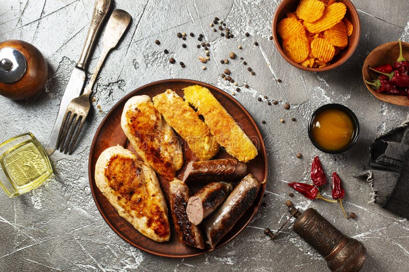 Fried Chicken with Sausages and White Fish Stock Image - Image of ...