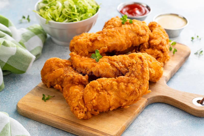 Fried Chicken Tenders on a Serving Board with Sauces and Salad Stock ...