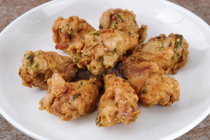 Fried Chicken in a White Ceramic Plate on a Wooden Table Stock Image ...