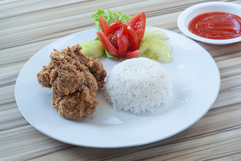 Fried Chicken with White Rice and Vegetables As Garnish Stock Photo ...