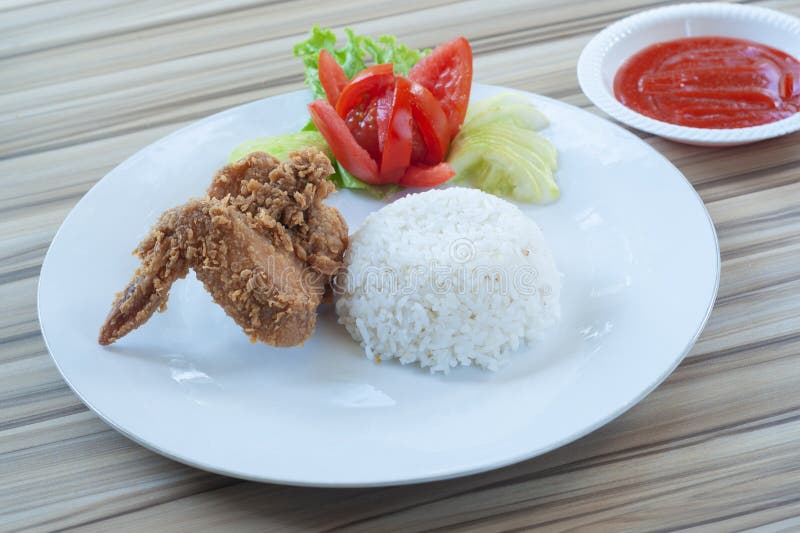 Fried Chicken with White Rice and Vegetables As Garnish Stock Image ...