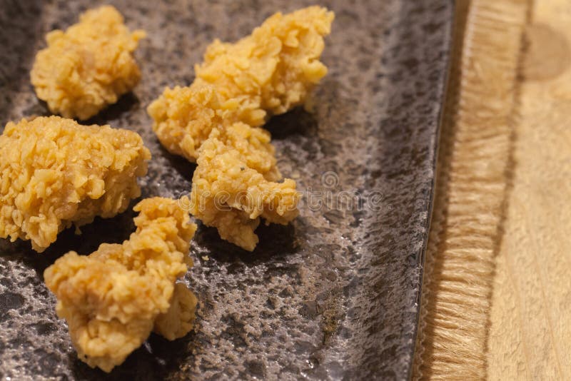 Fried Chickens on Black Plate Stock Photo - Image of barbecue, grill ...
