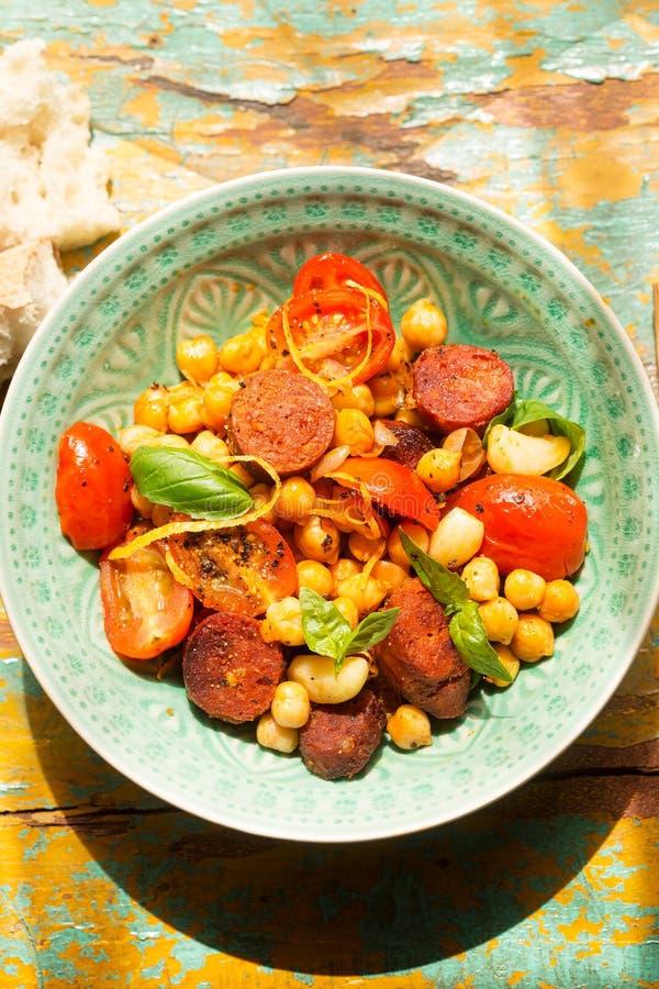Fried Chorizo Sausage with Chickpeas, Tomatoes & Basil Stock Photo ...