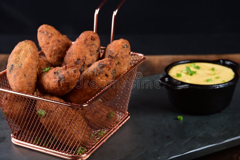 Fried Cod Ball, Fish Meat and Herb Sauce Served on Stone Table Stock ...