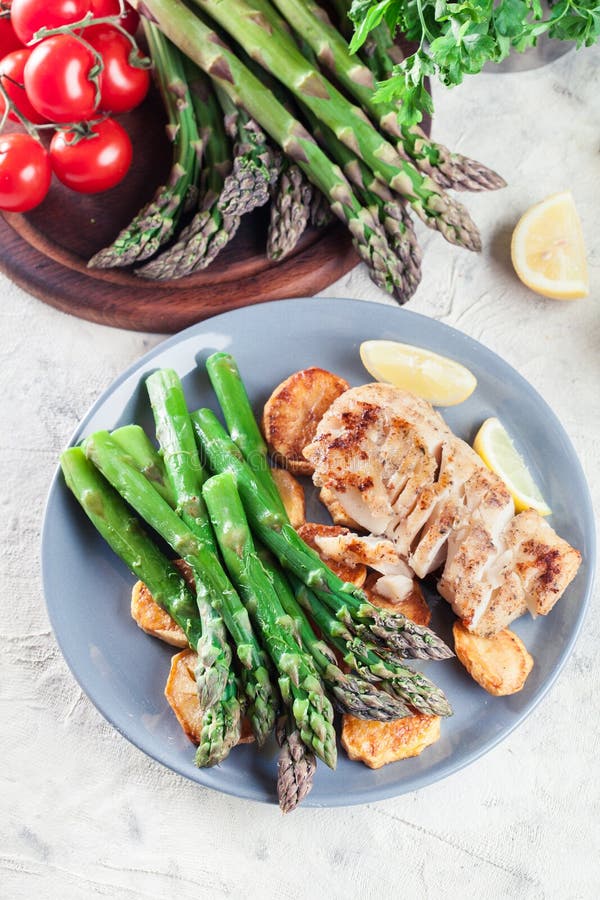 Fried Cod Fillet with Green Asparagus Stock Photo - Image of overhead ...