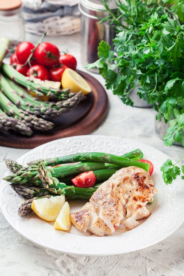 Fried Cod Fillet with Green Asparagus Stock Photo - Image of foodie ...