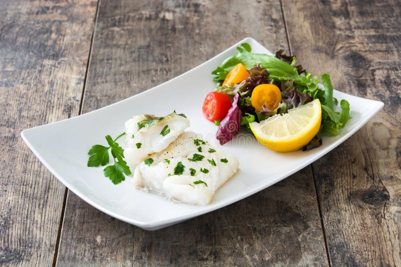 Fried cod fillet and salad stock image. Image of spice - 85202653