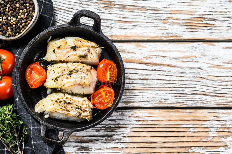 Fried Cod Fish Fillet with Spice in a Cast Iron Pan. White Background ...