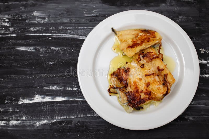 Fried Cod Fish with Olive Oil on White Dish Stock Image - Image of ...