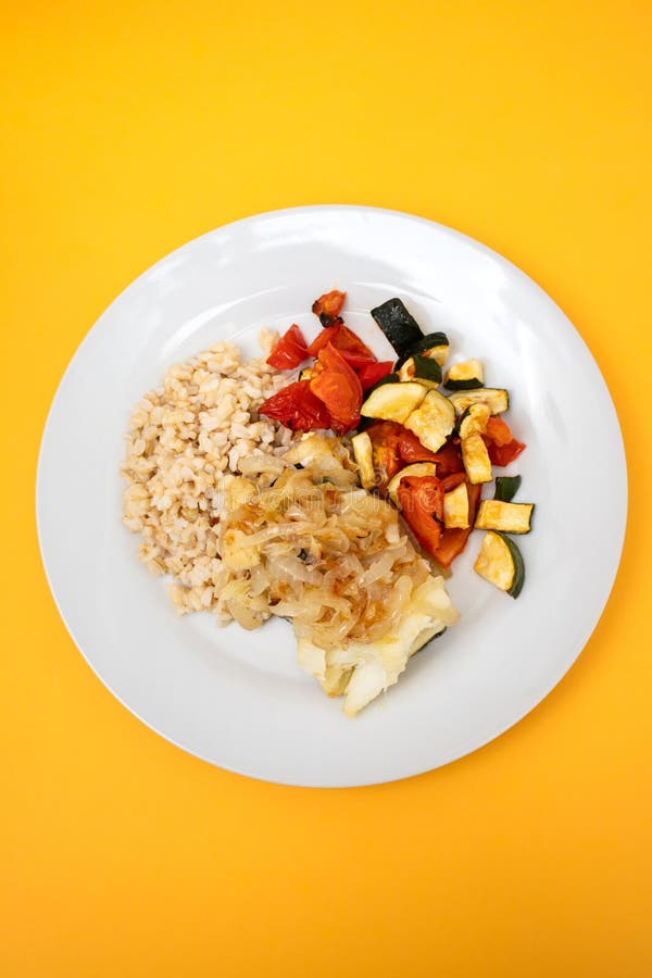 Fried Cod Fish with Onion, Vegetables, Rice and Olive Oil on Plate ...
