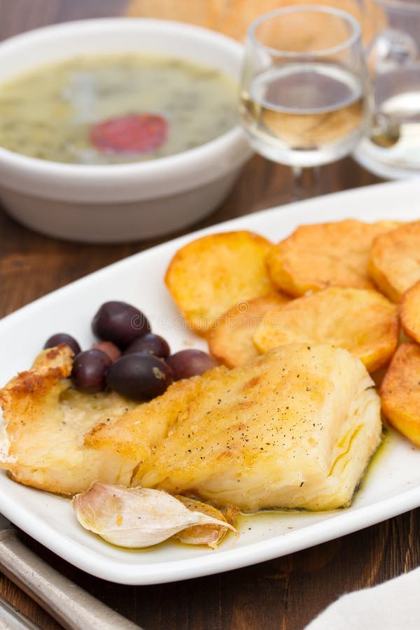Fried Cod Fish with Potato on White Dish Stock Photo - Image of ...