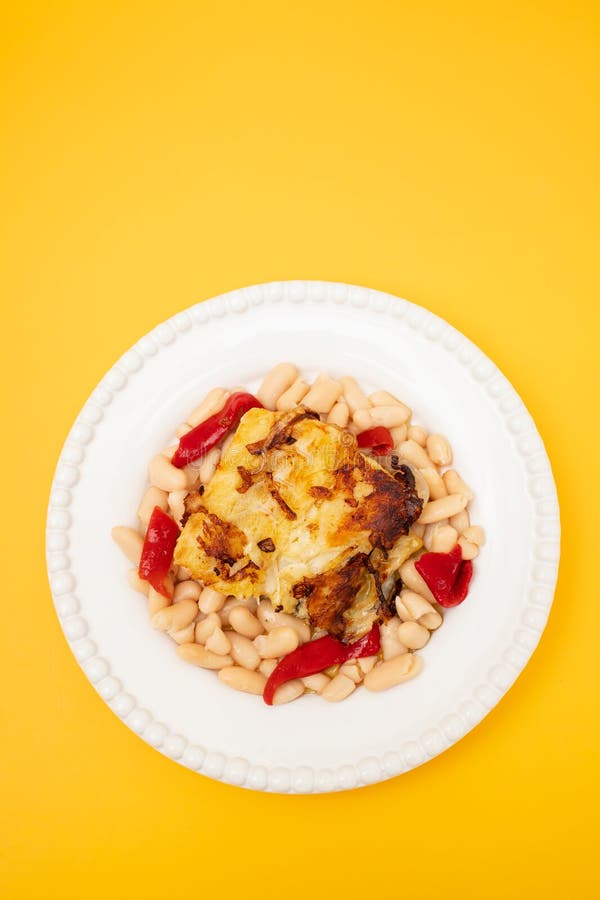 Fried Cod Fish with White Beans and Grilled Red Pepper Stock Image ...