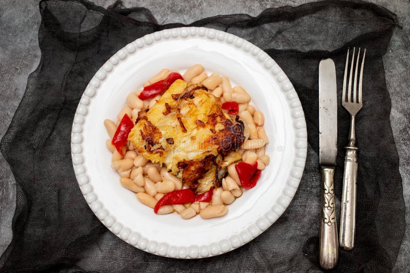Fried Cod Fish with White Beans and Grilled Red Pepper Stock Photo ...
